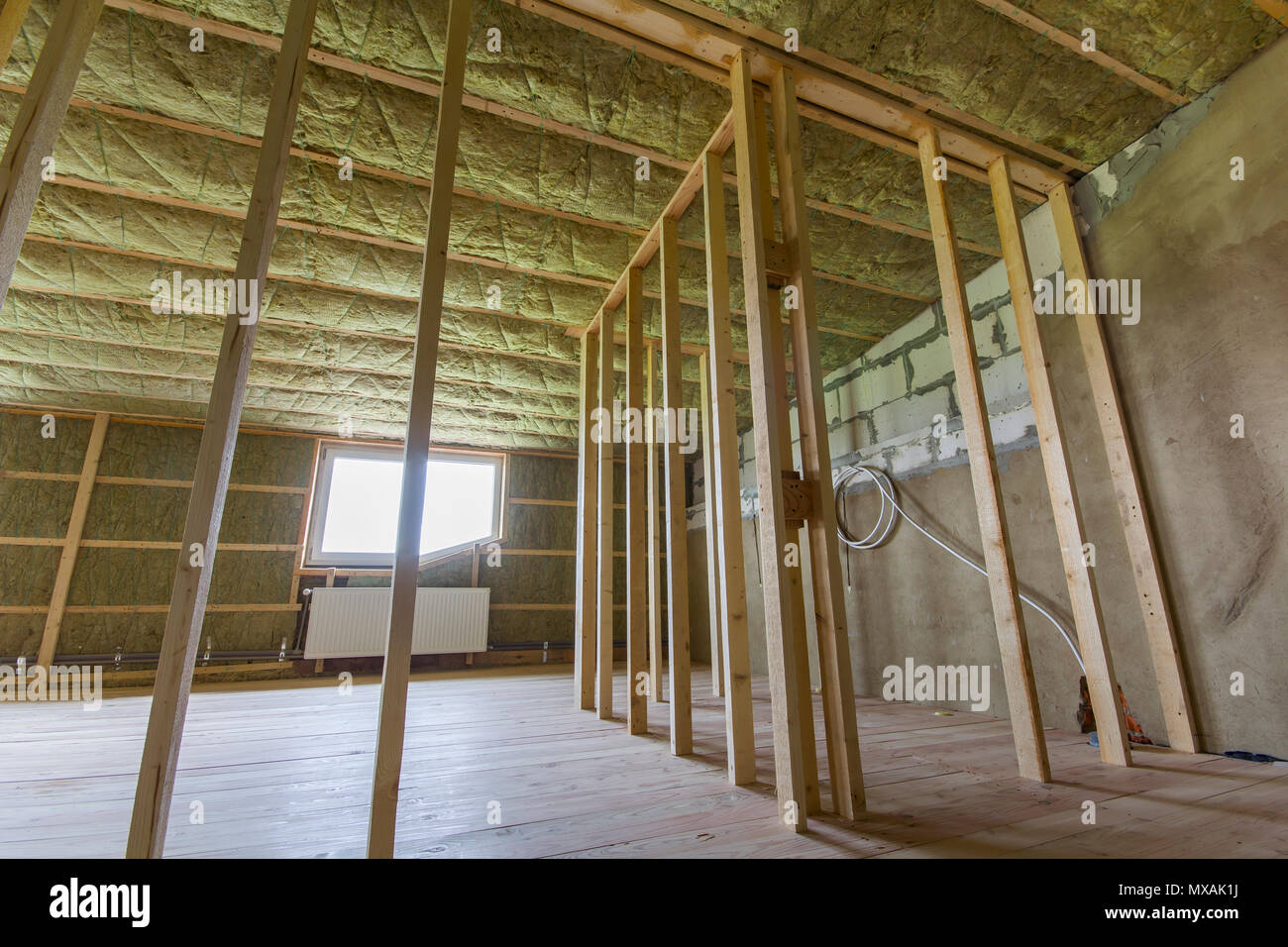 Construction and renovation of big light spacious empty room with oak ...