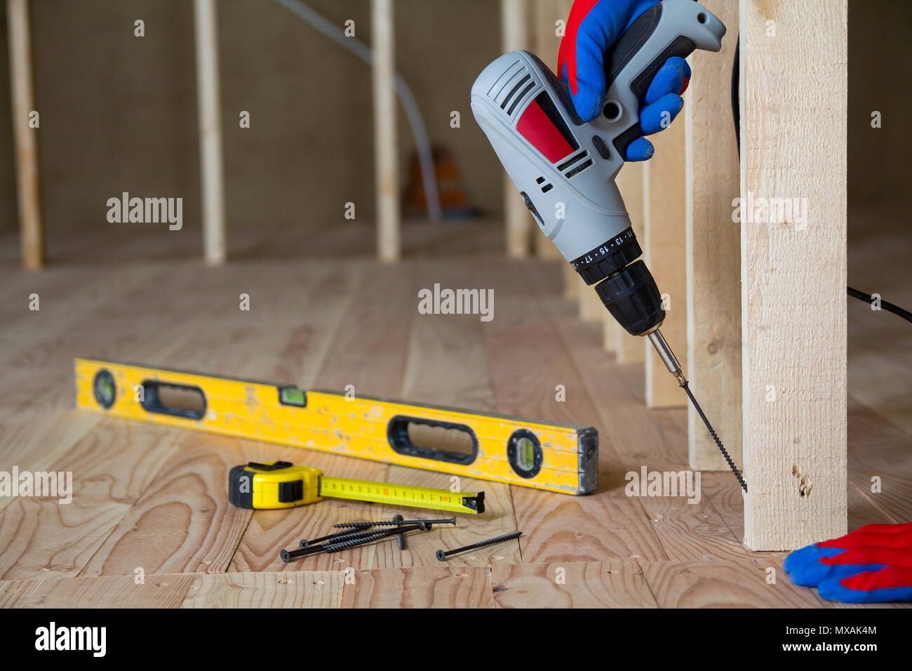 Close-up of worker's hands with screwdriver on background of ...