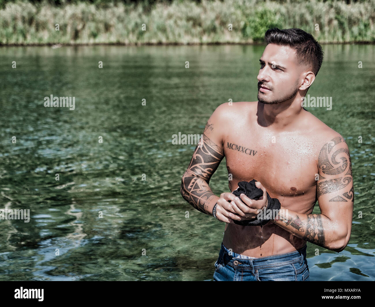 Man standing by pond hi-res stock photography and images - Alamy