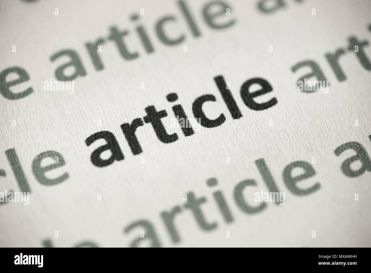 word article printed on white paper macro Stock Photo - Alamy
