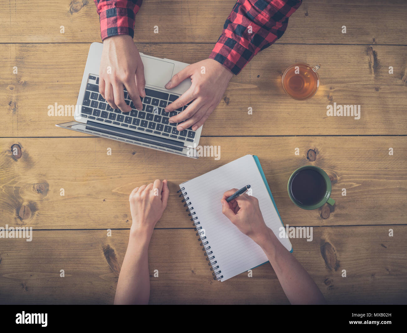 Office table notepad computer tea hi-res stock photography and images ...