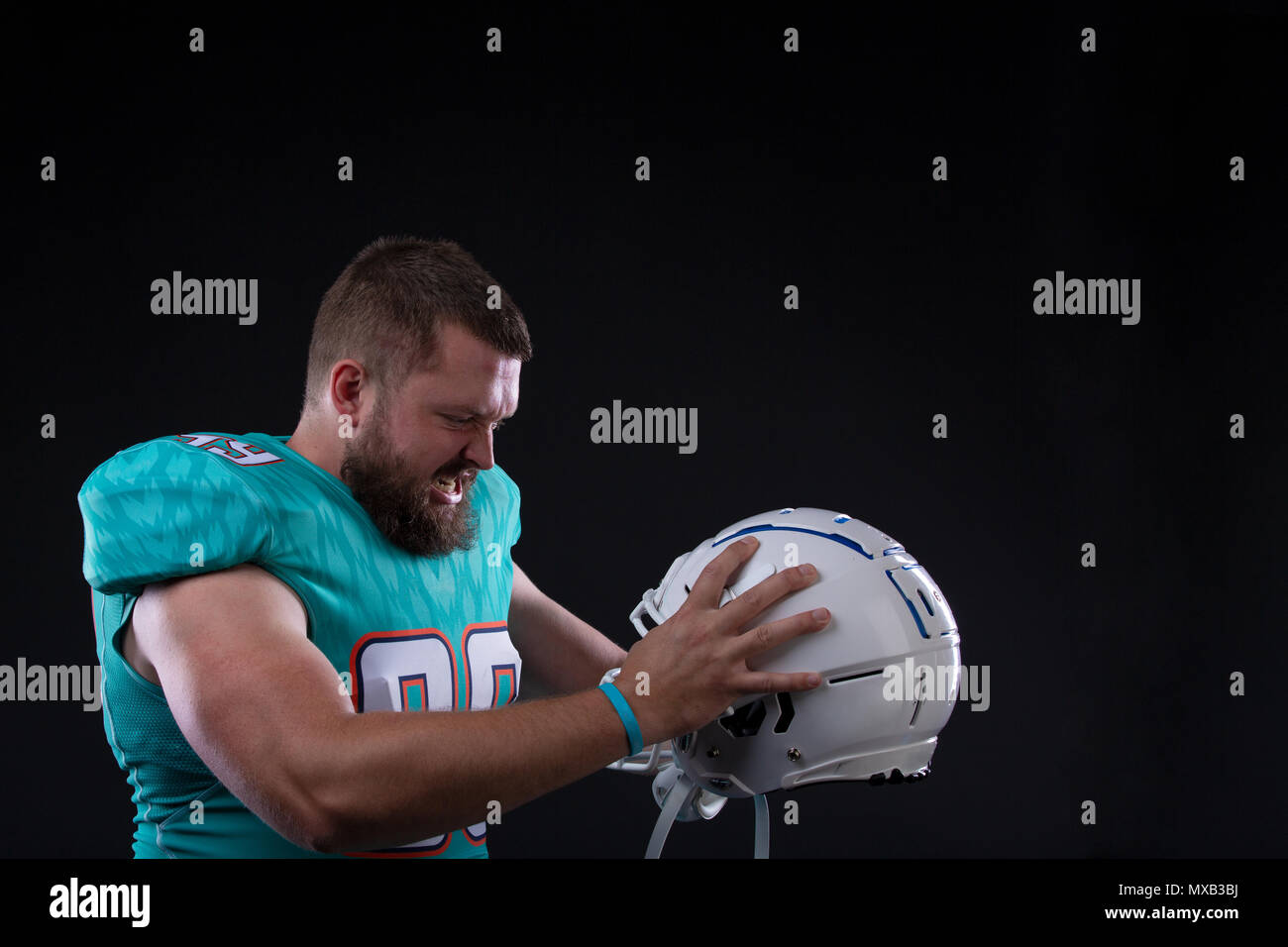 Victory Agressive American football player screaming at the helmet ...