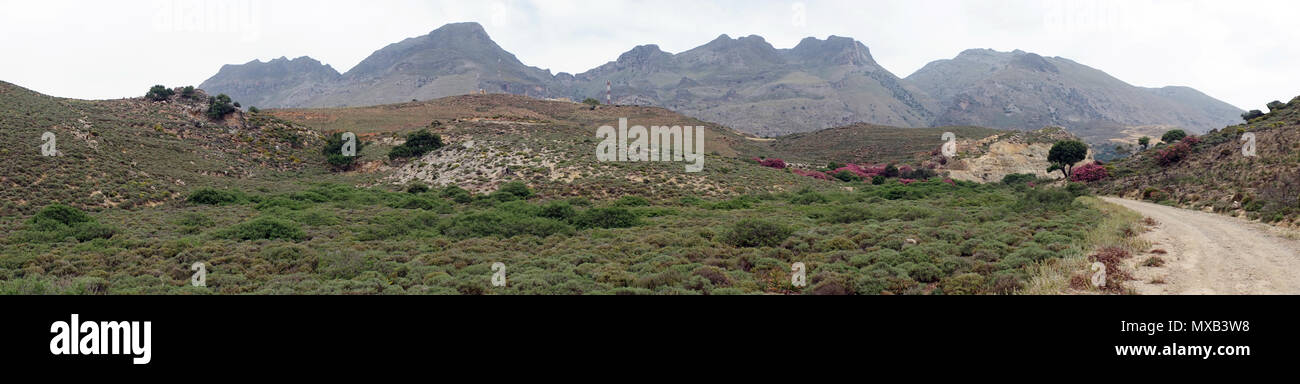 Dirt road on the slope of mount in Crete, Greece Stock Photo - Alamy