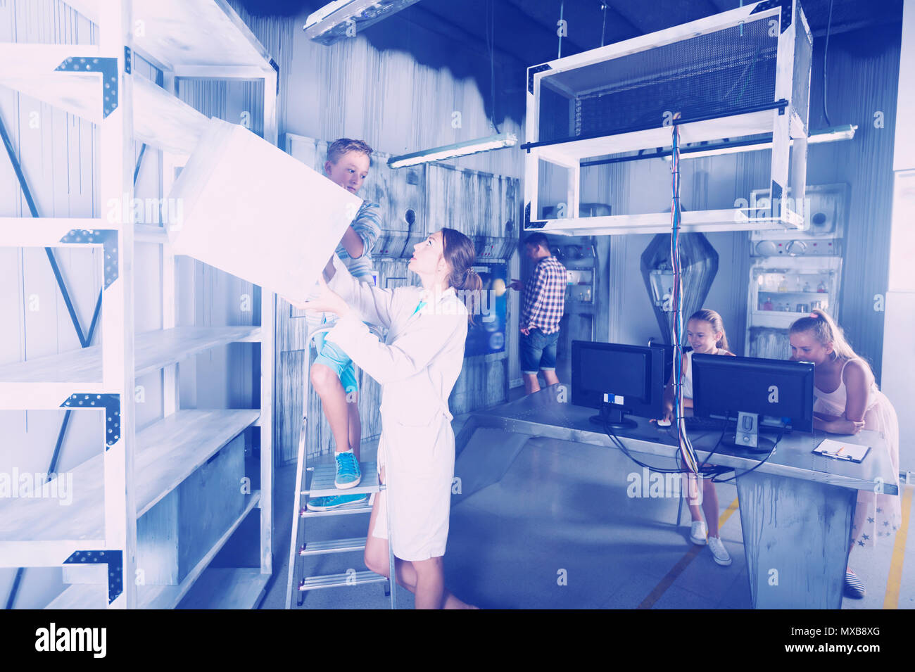 Happy family is passing of quest room stylized under laboratory using a ...