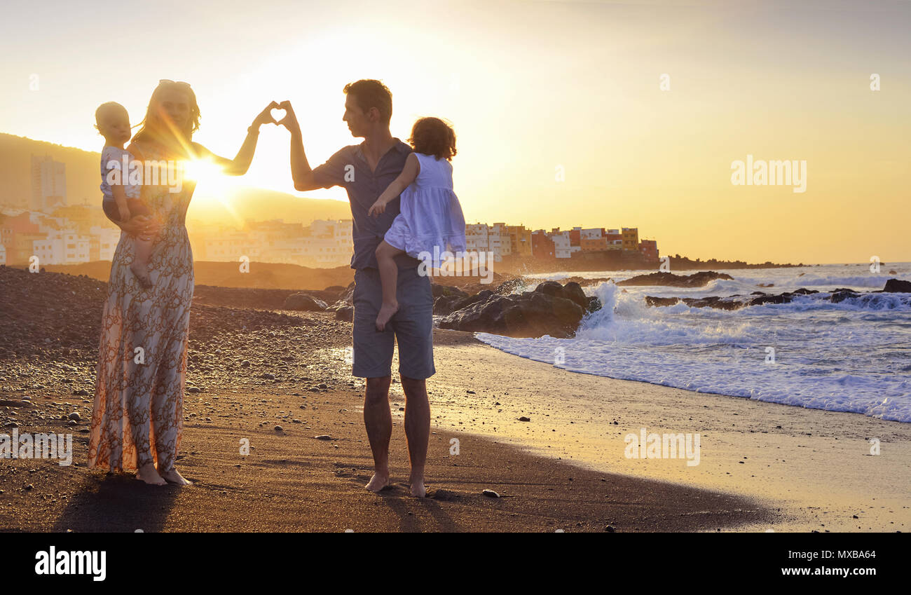 Family sunbathing beach hi-res stock photography and images - Alamy