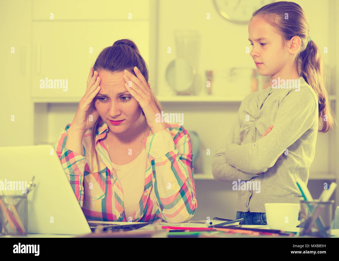 Irritated mother watching at the mistakes her daughter's homework Stock ...