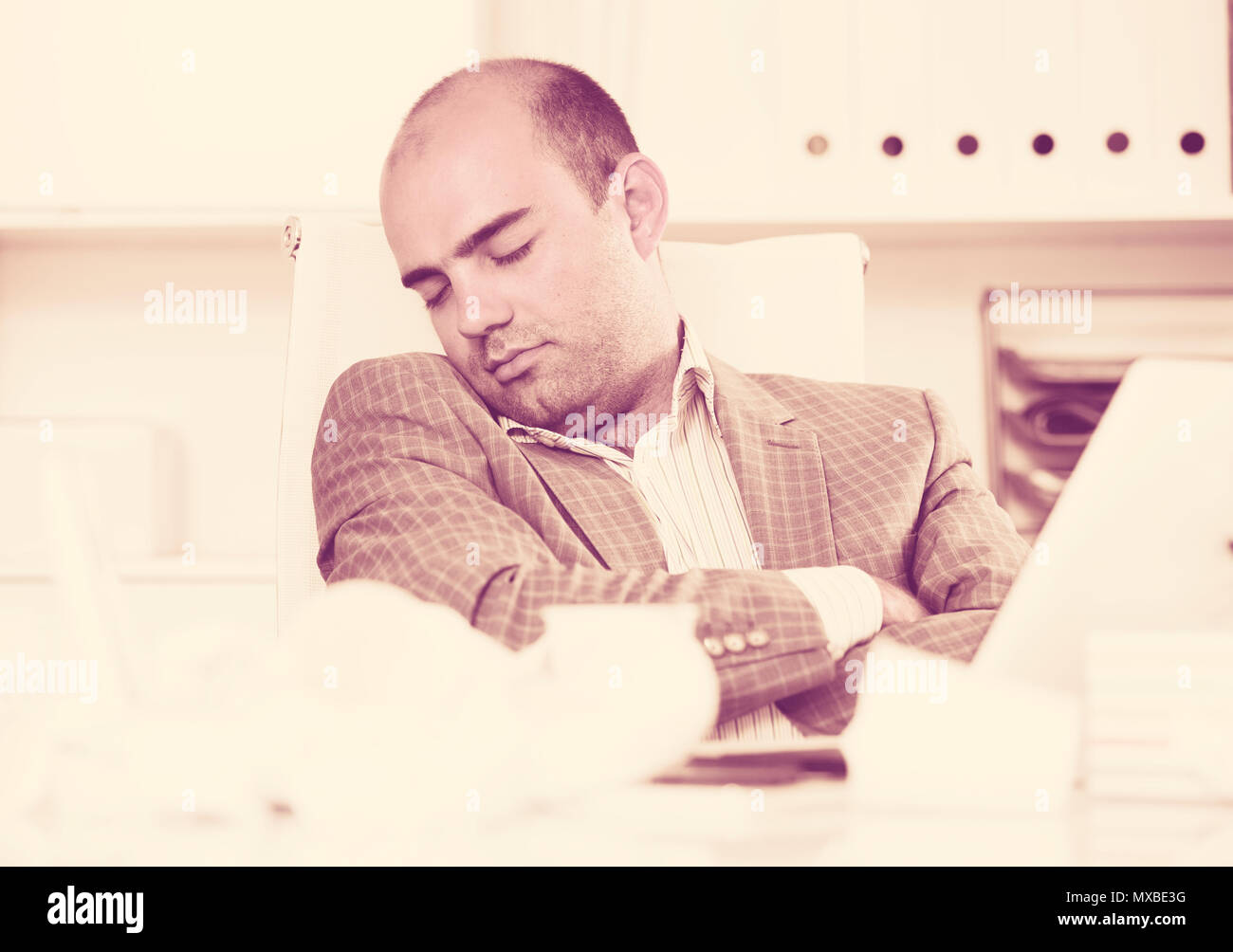 Young sad man tired of working and sleeping in the modern office Stock ...