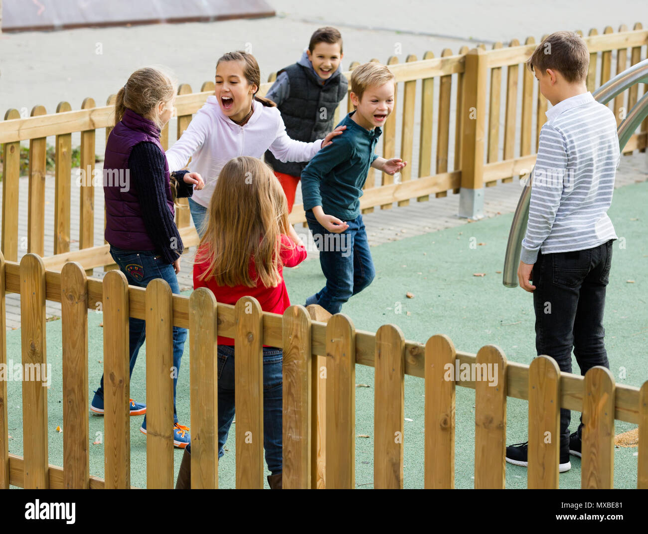 Little boys and girls playing Touch-last active game outdoor Stock ...
