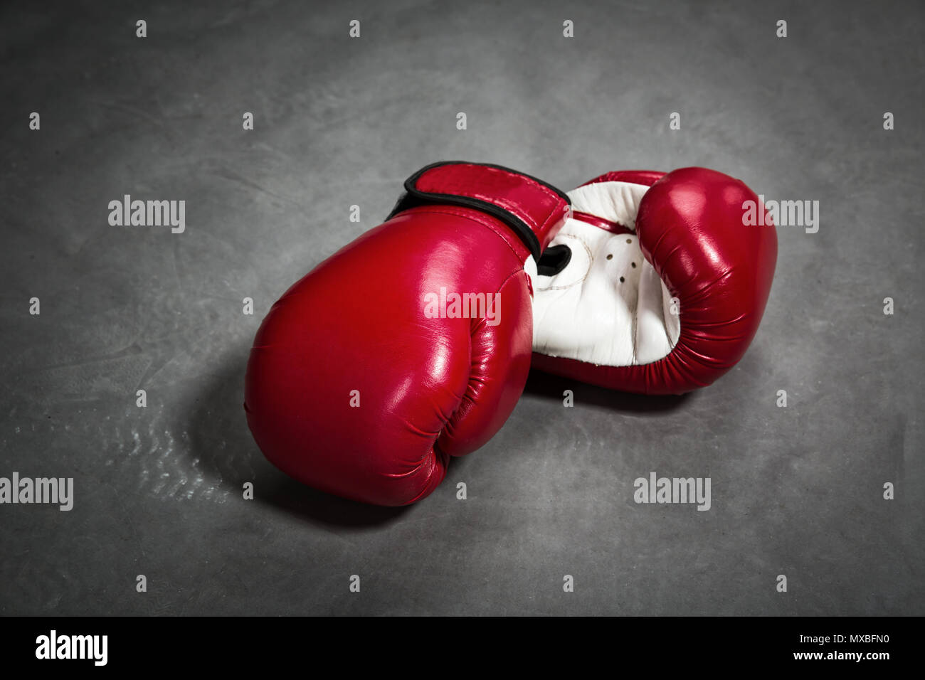 Red boxing gloves. Fighting sport concept, box symbol Stock Photo - Alamy