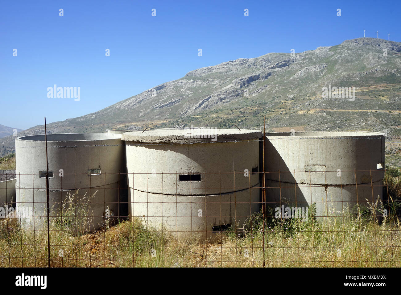 Cement blocks near the road Stock Photo - Alamy