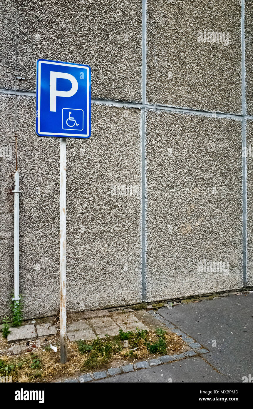 wall and disabled parking sign Stock Photo - Alamy