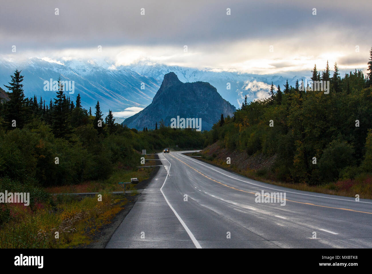 Lion's head on the end of the road in Alaska. Bad weather Stock Photo ...