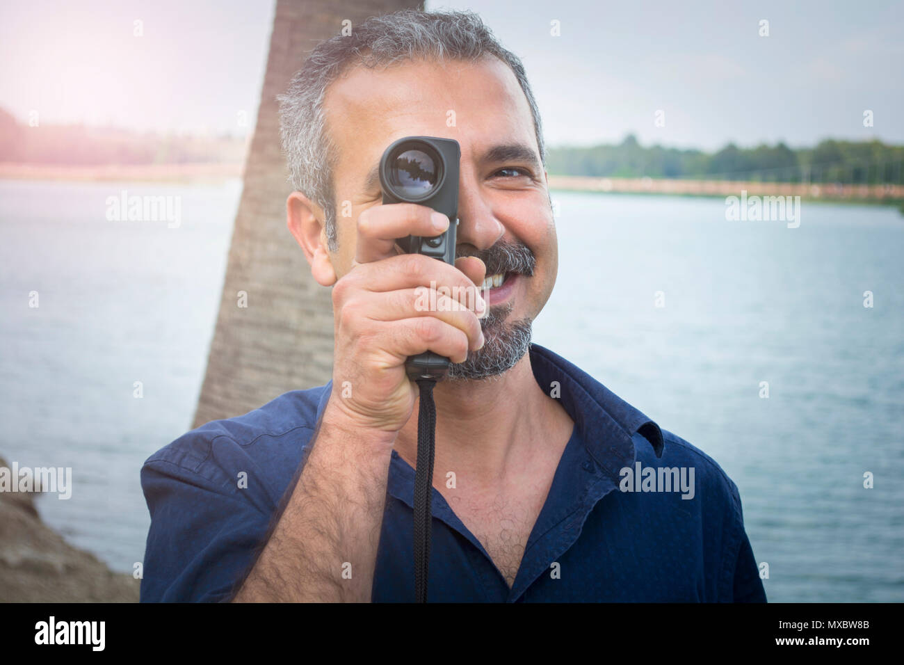 Man with old vintage camera in hands Stock Photo - Alamy
