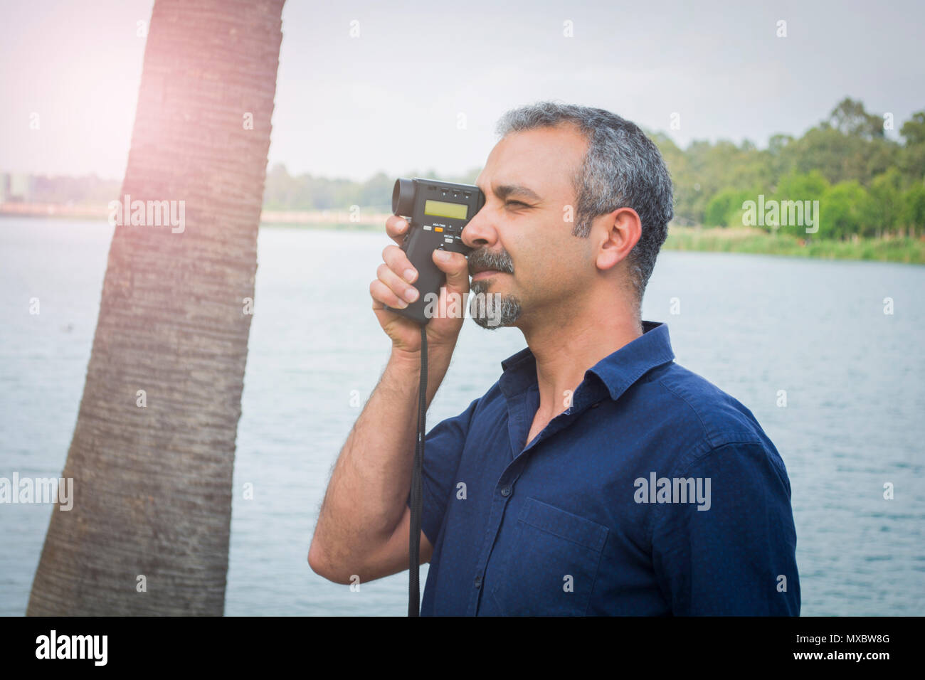 Man with old vintage camera in hands Stock Photo - Alamy