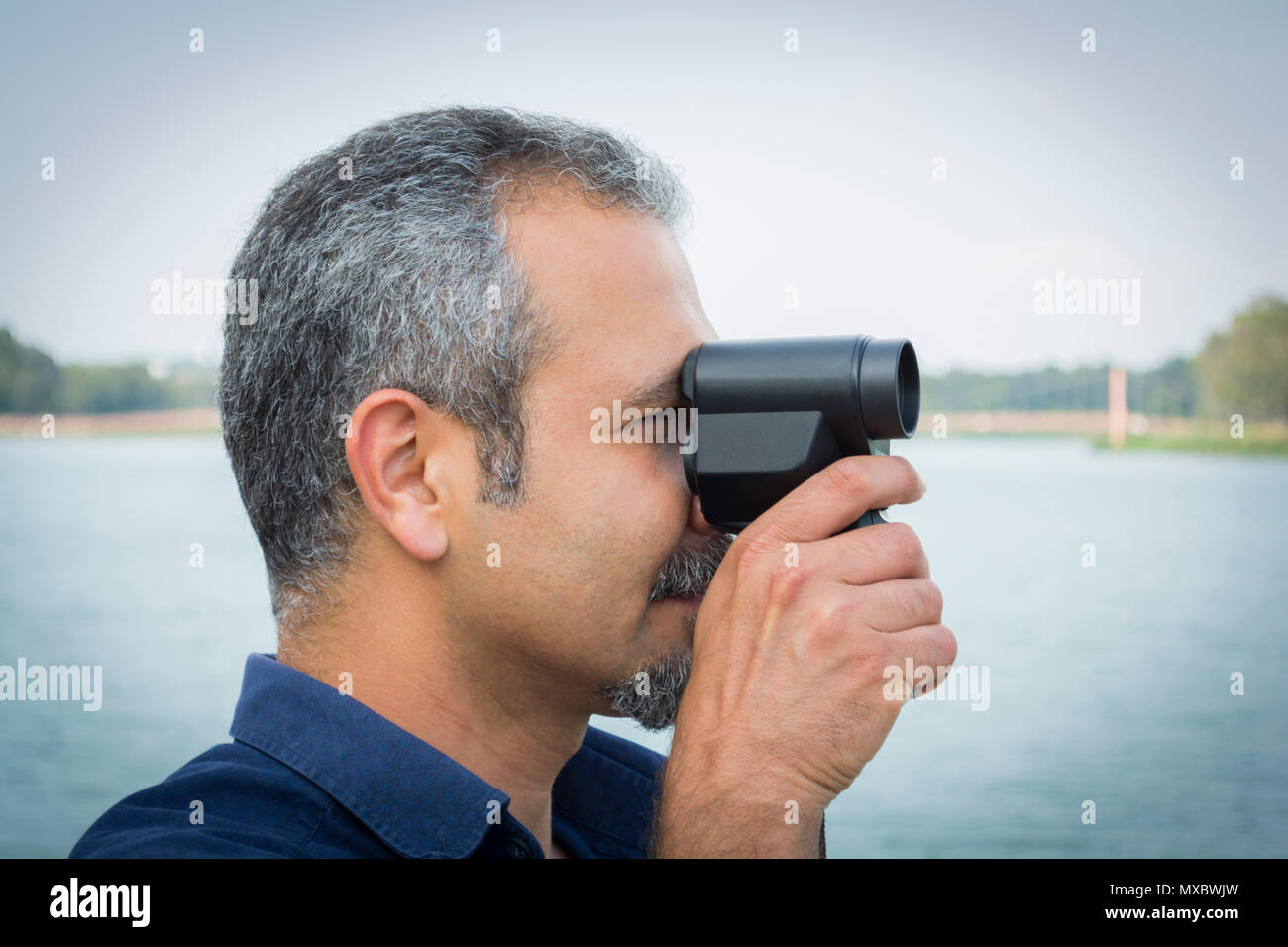 Man with old vintage camera in hands Stock Photo - Alamy