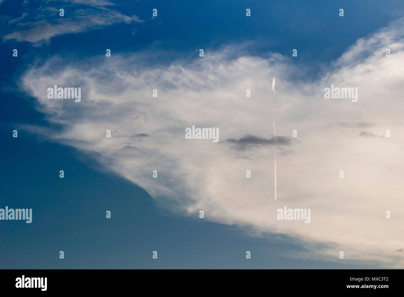 airplane crossing the clouds Stock Photo - Alamy