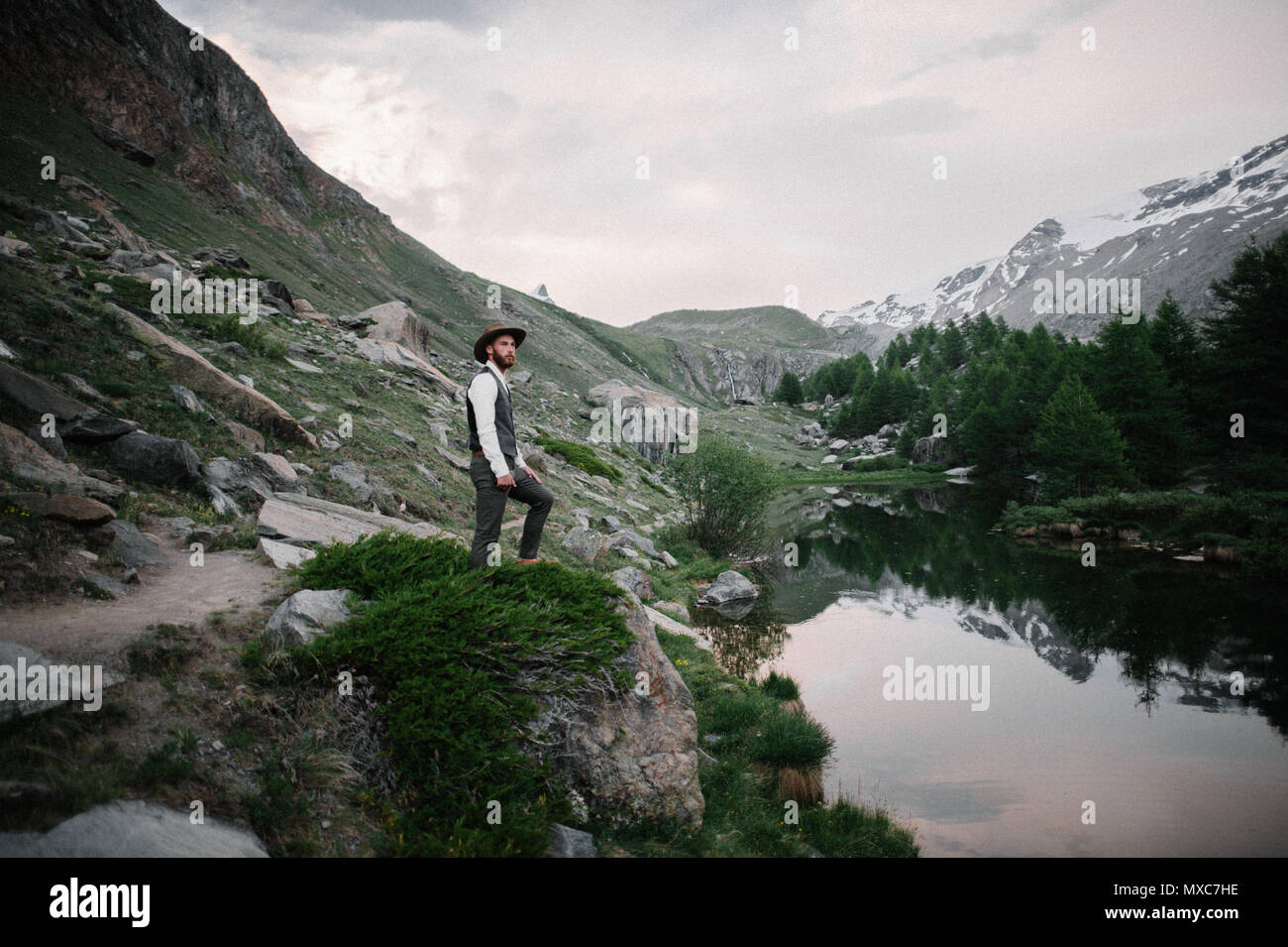 Stylish young wedding couple posing in beautiful Matterhorn moun Stock ...