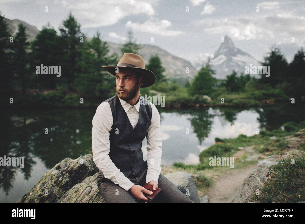 Stylish young wedding couple posing in beautiful Matterhorn moun Stock ...