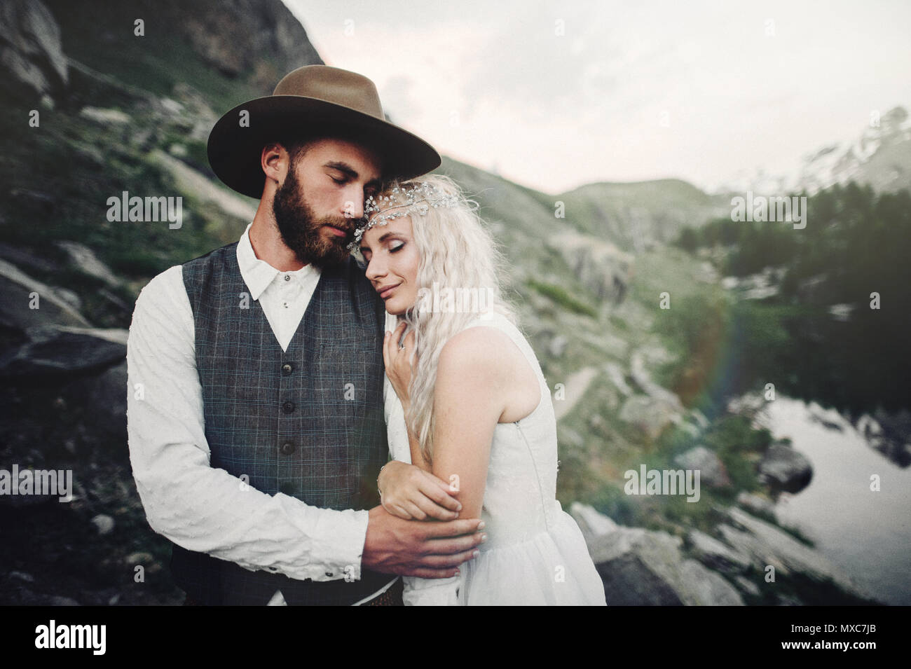 Stylish young wedding couple posing in beautiful Matterhorn moun Stock ...