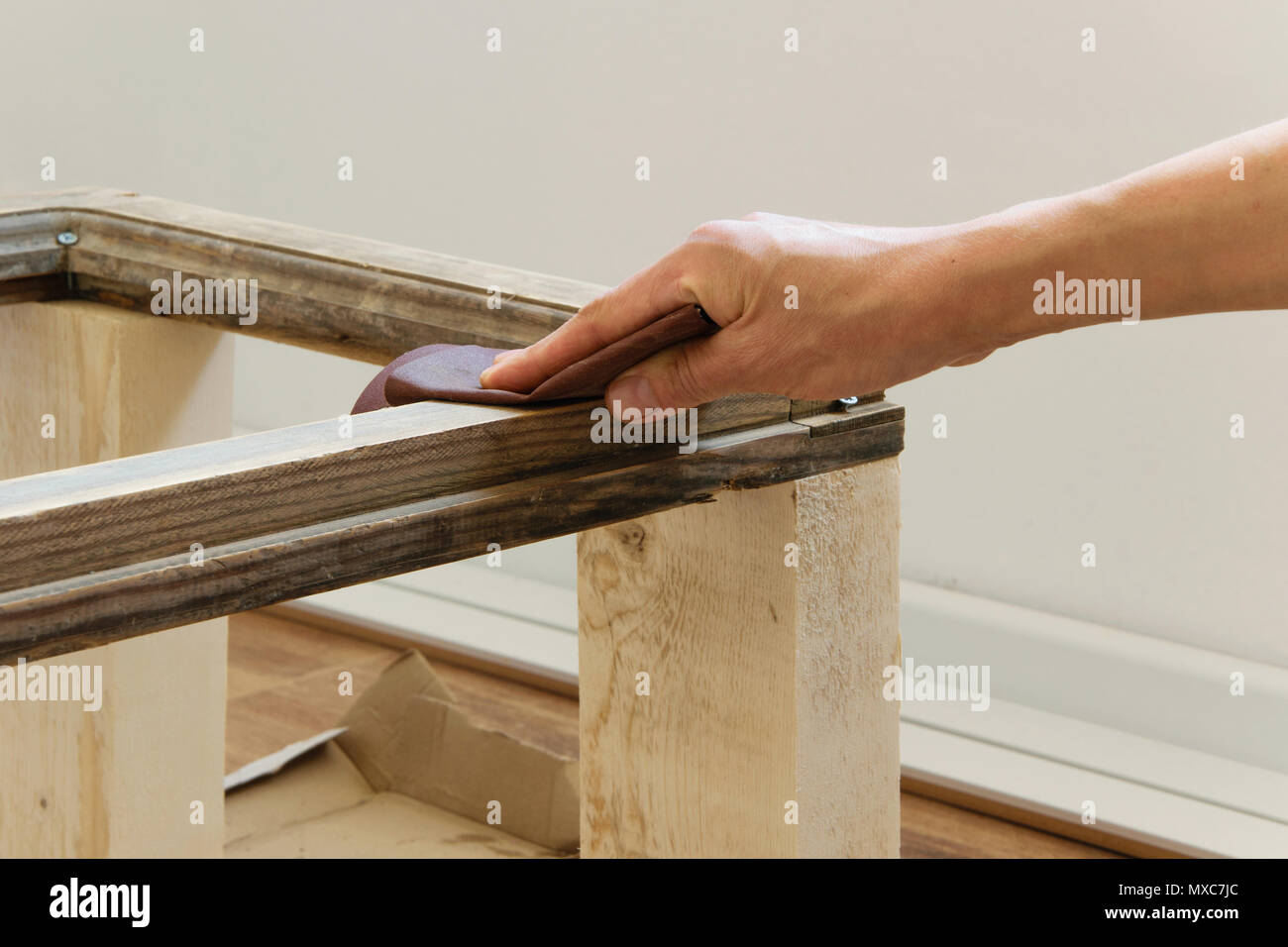 Sanding A Table With Sandpaper High Resolution Stock Photography and ...