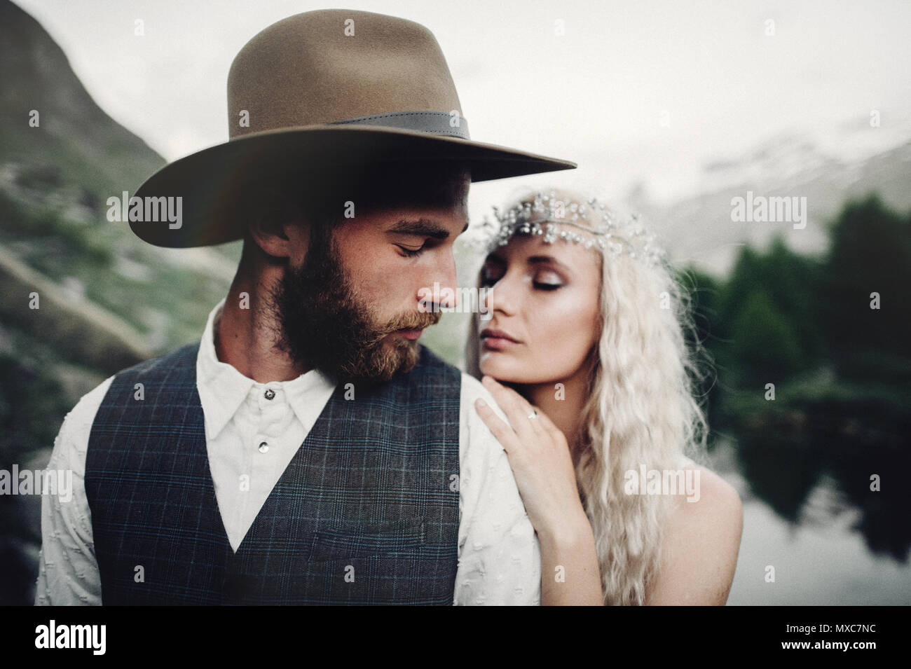 Stylish young wedding couple posing in beautiful Matterhorn moun Stock ...