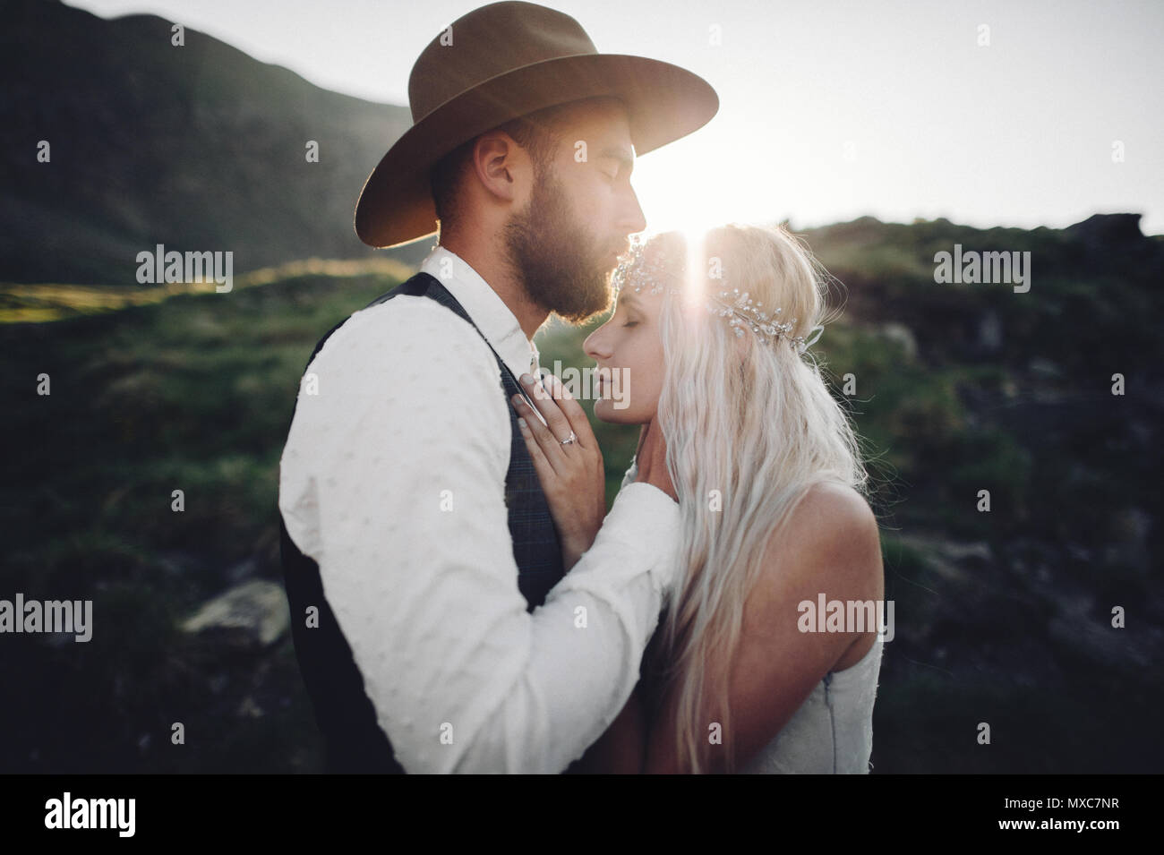 Stylish young wedding couple posing in beautiful Matterhorn moun Stock ...