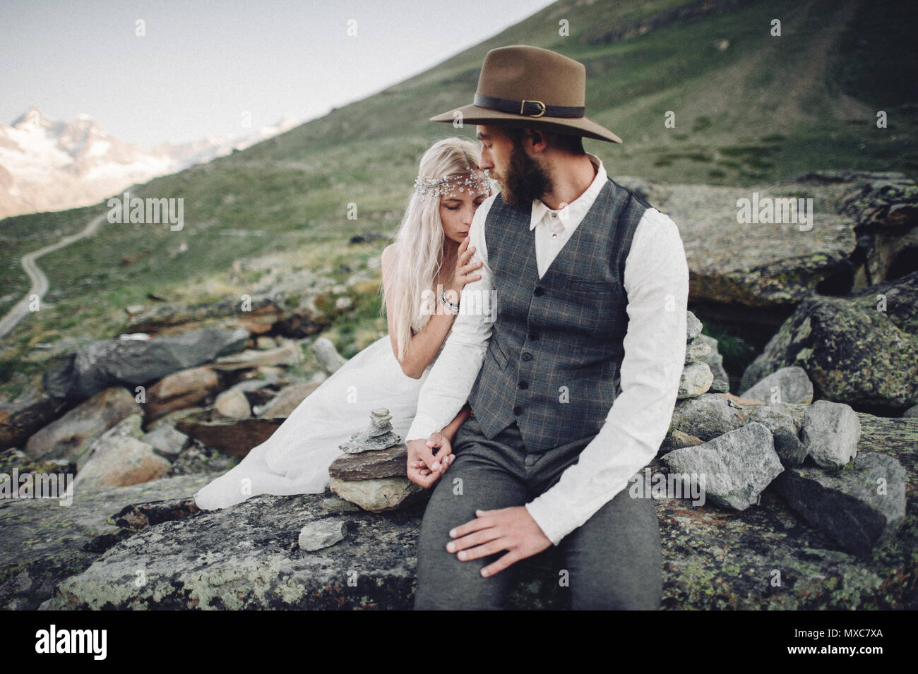 Stylish young wedding couple posing in beautiful Matterhorn moun Stock ...