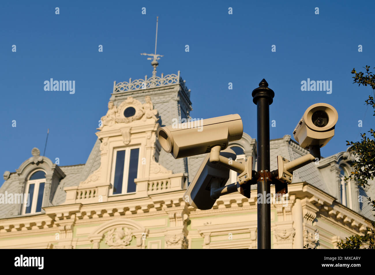 Security CCTV camera on street lamp in the city center Stock Photo - Alamy