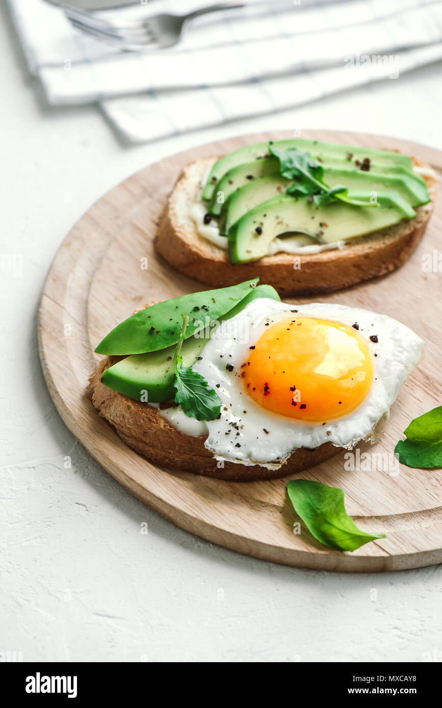 Avocado Sandwich With Fried Egg Sliced Avocado And Egg On Toasted