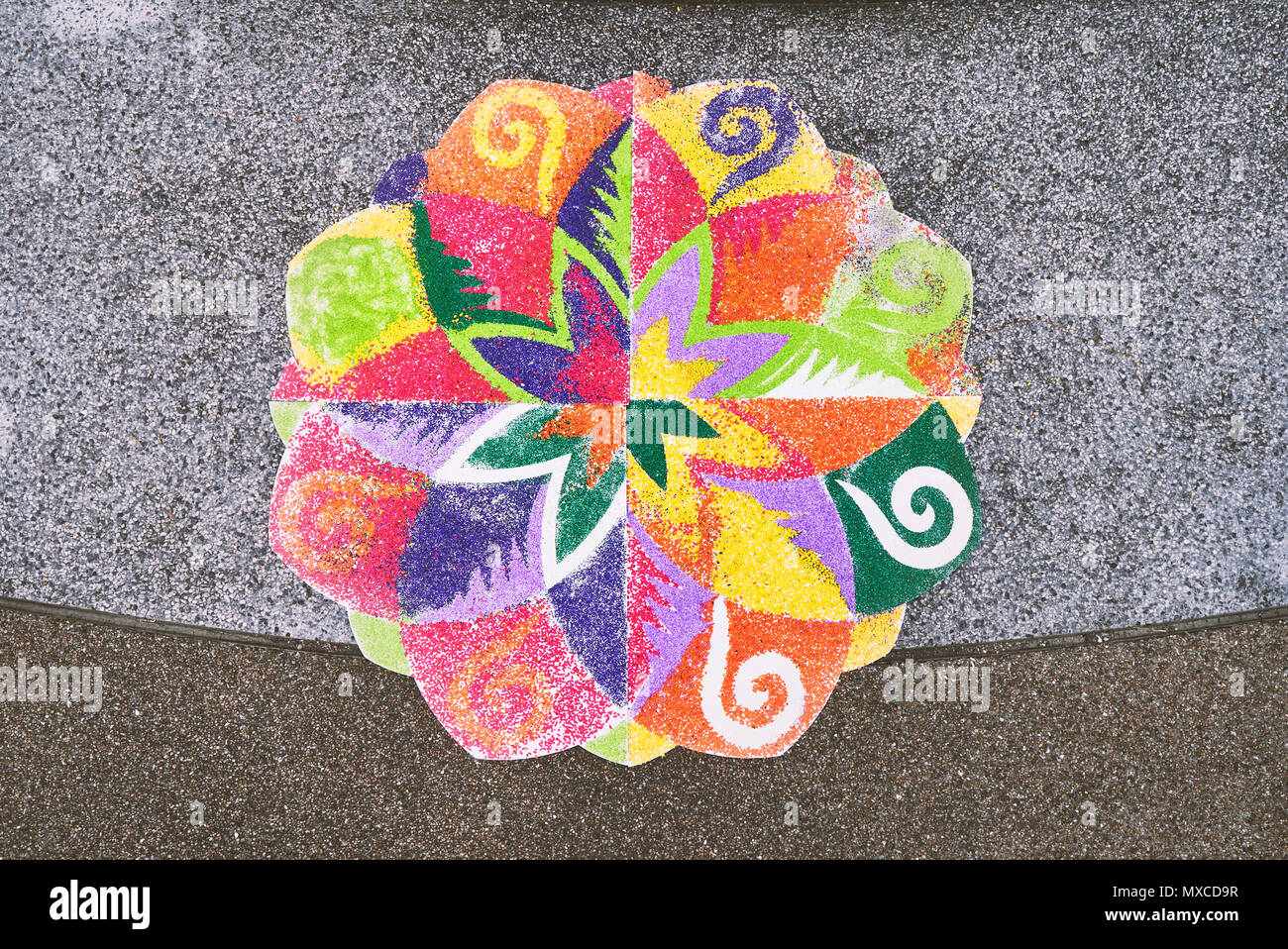 The rangoli or sand art or rice art with colorful decoration on the ...