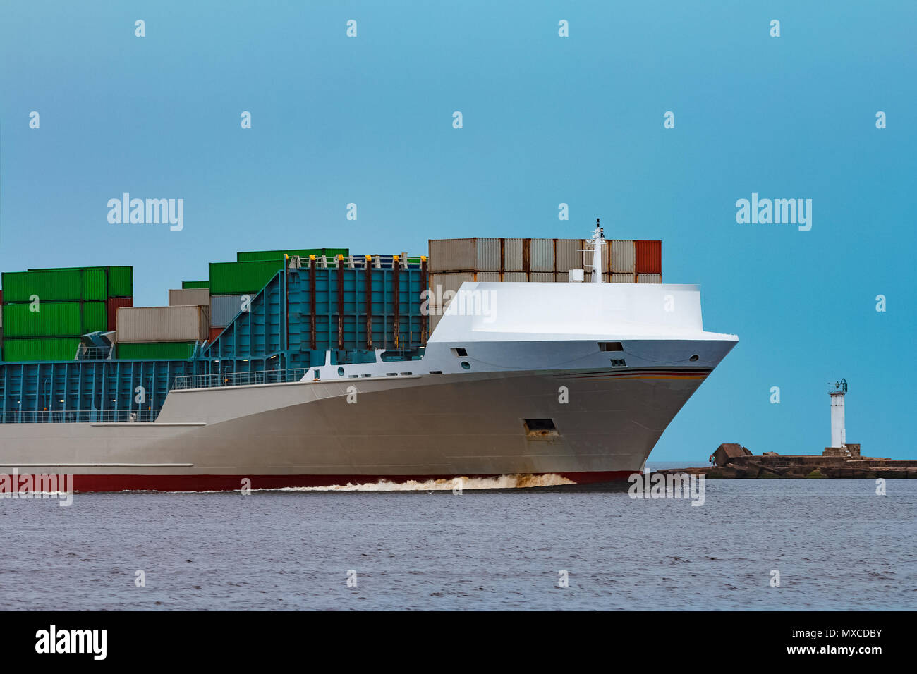 Grey container ship. Logistics and production import Stock Photo - Alamy