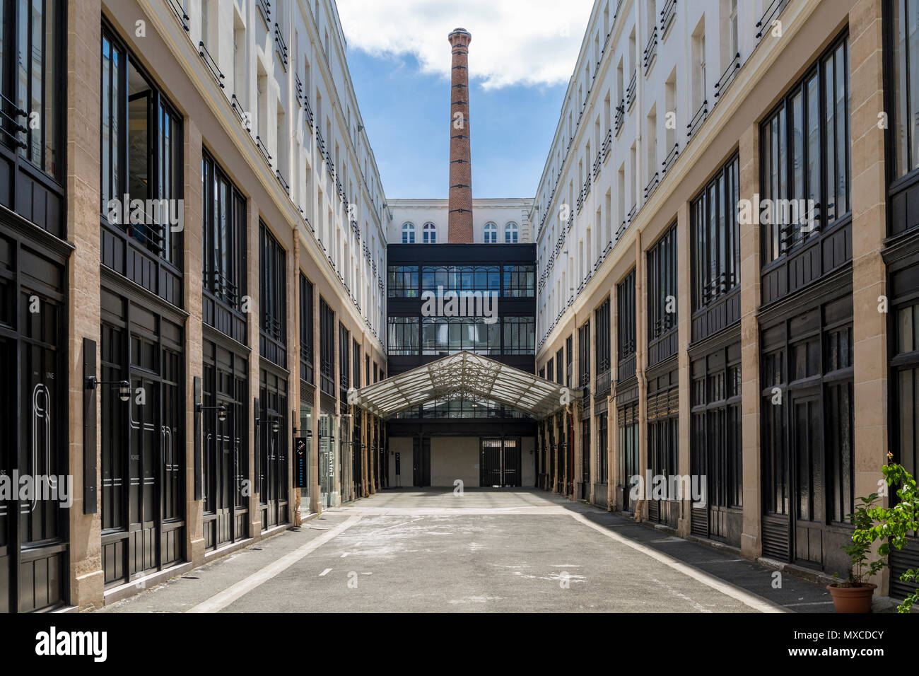 Old industrial factory and chimney, converted to modern offices along ...