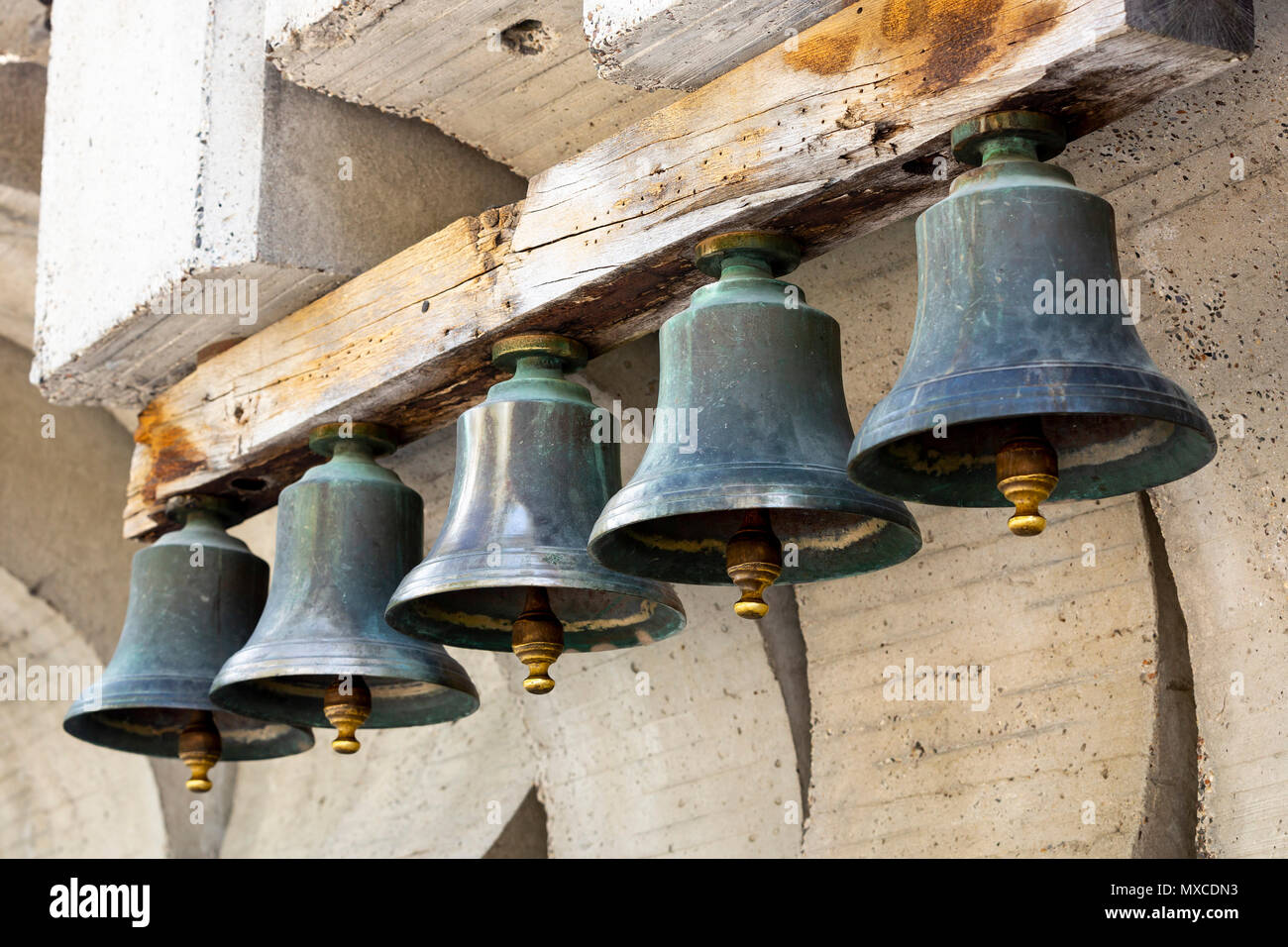 Many old bells - campanes are seen in a row Stock Photo - Alamy