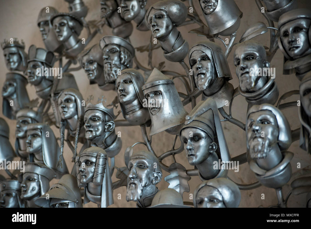 A display of metal heads inside Corey castle - Jersey Stock Photo - Alamy