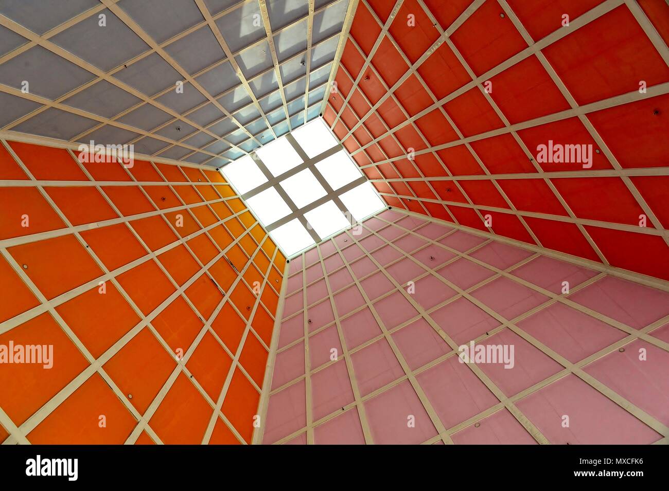 Abstract perspective of vertical lobby ceiling with skylight and strong ...