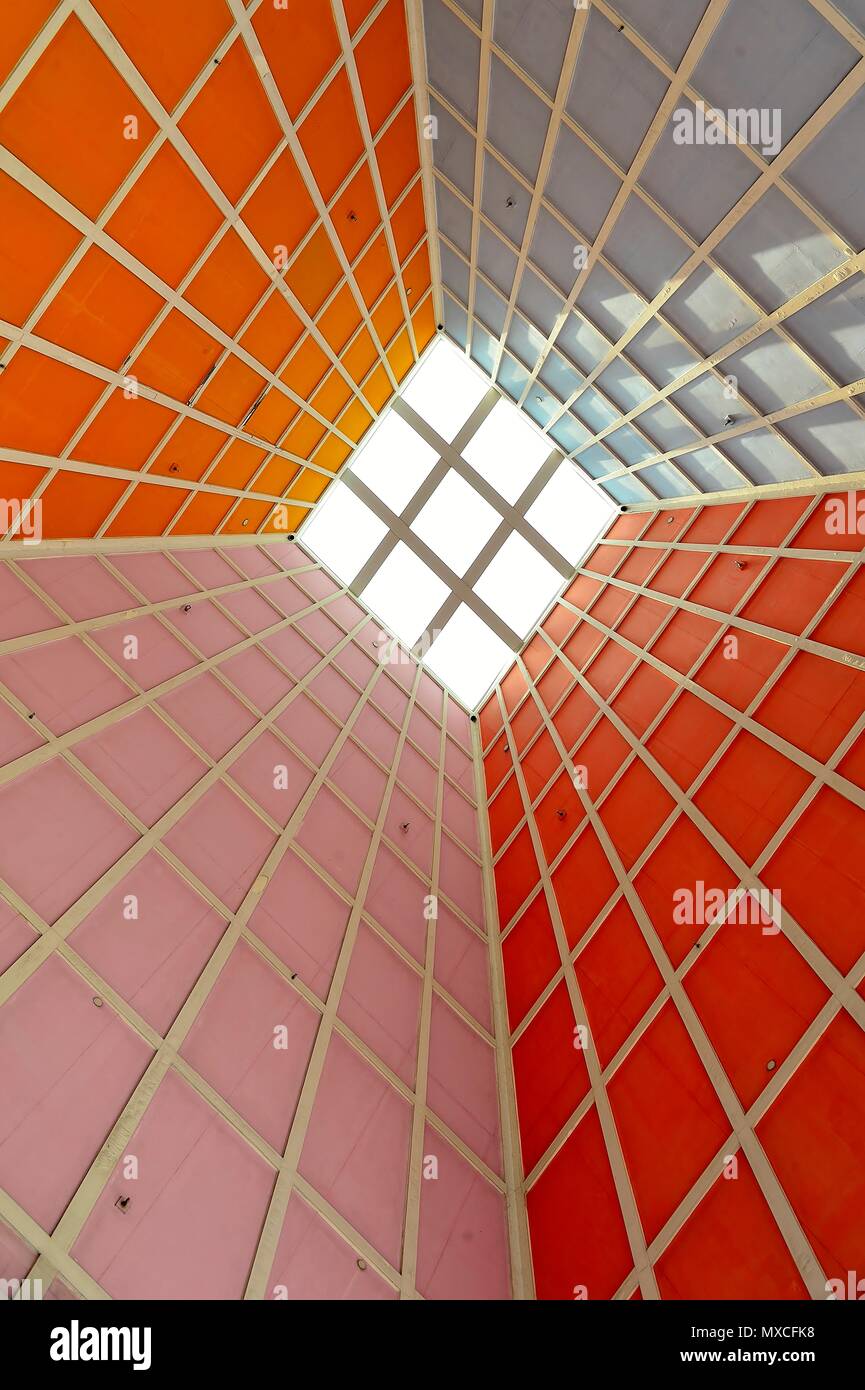 Abstract perspective of vertical lobby ceiling with skylight and strong ...