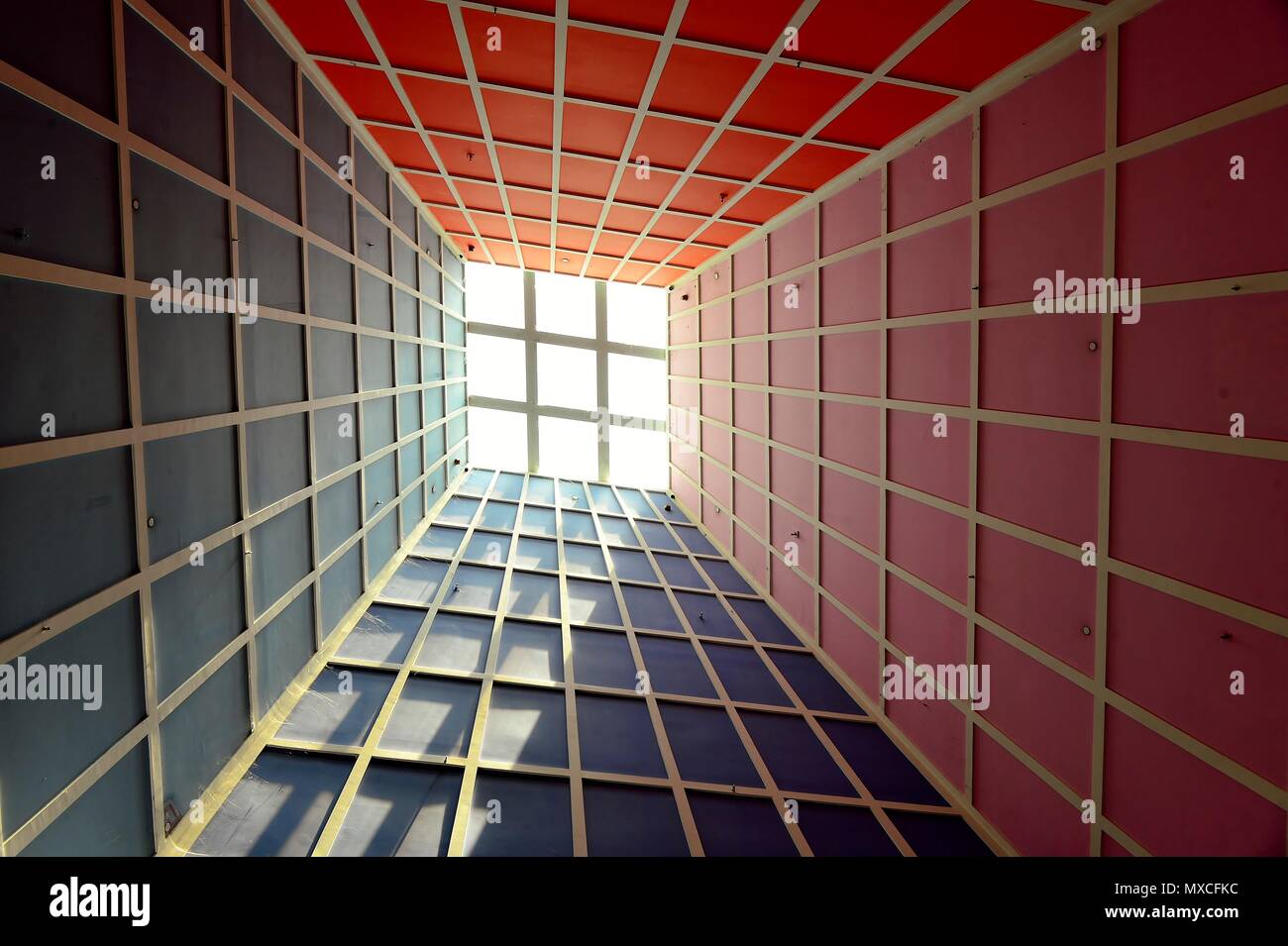 Abstract perspective of vertical lobby ceiling with skylight and strong ...