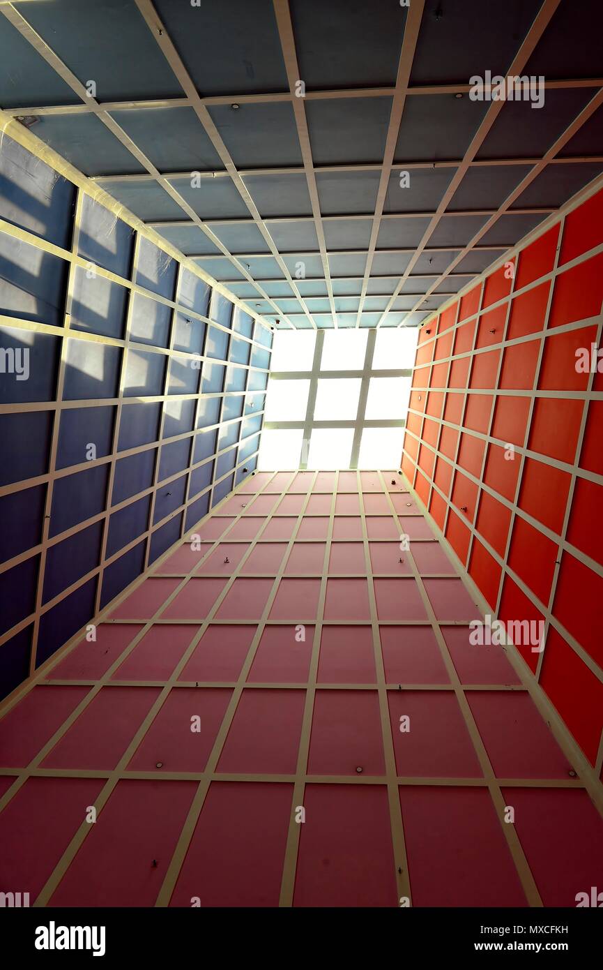 Abstract perspective of vertical lobby ceiling with skylight and strong ...