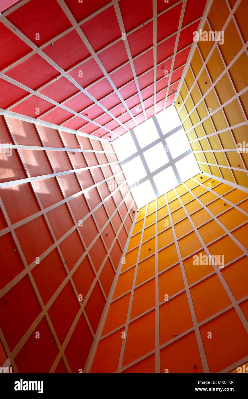 Abstract perspective of vertical lobby ceiling with skylight and strong ...