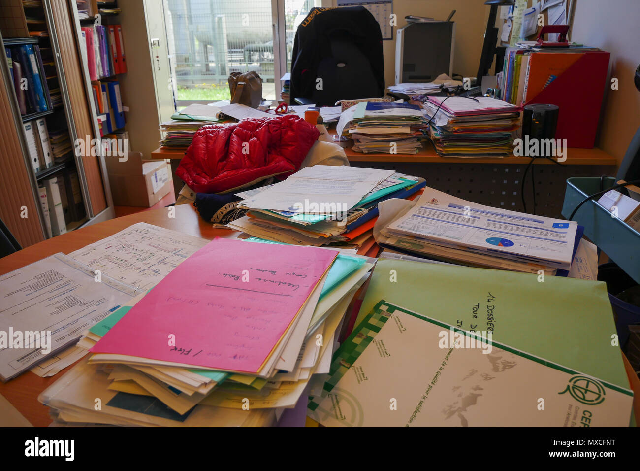 Realistic view of a messy desk, Lyon, France Stock Photo - Alamy