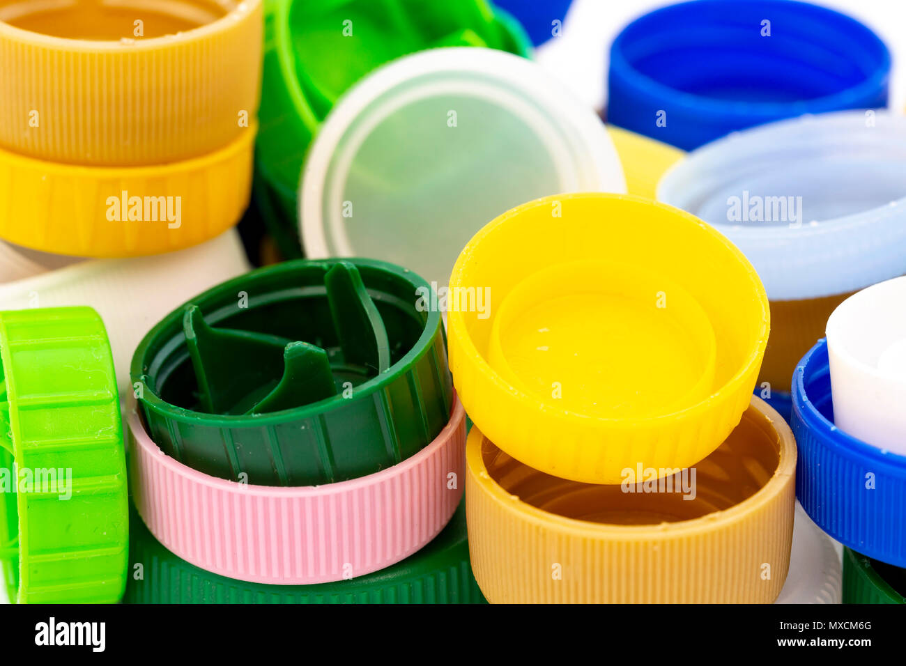 Colorful plastic bottle caps. Studio shot. Plastic waste Stock Photo ...
