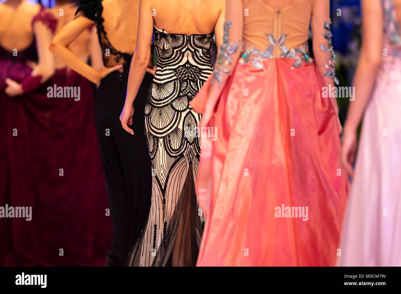 Female models walk the runway in different dresses during a Fashion ...