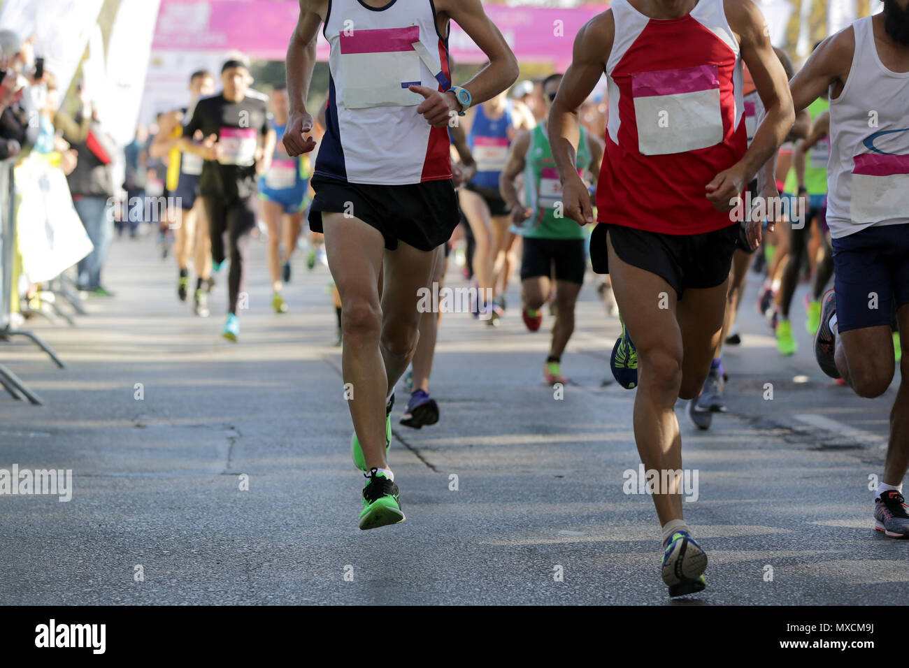 Marathon running race. Legs and bodies only. Unrecognizable people. The ...
