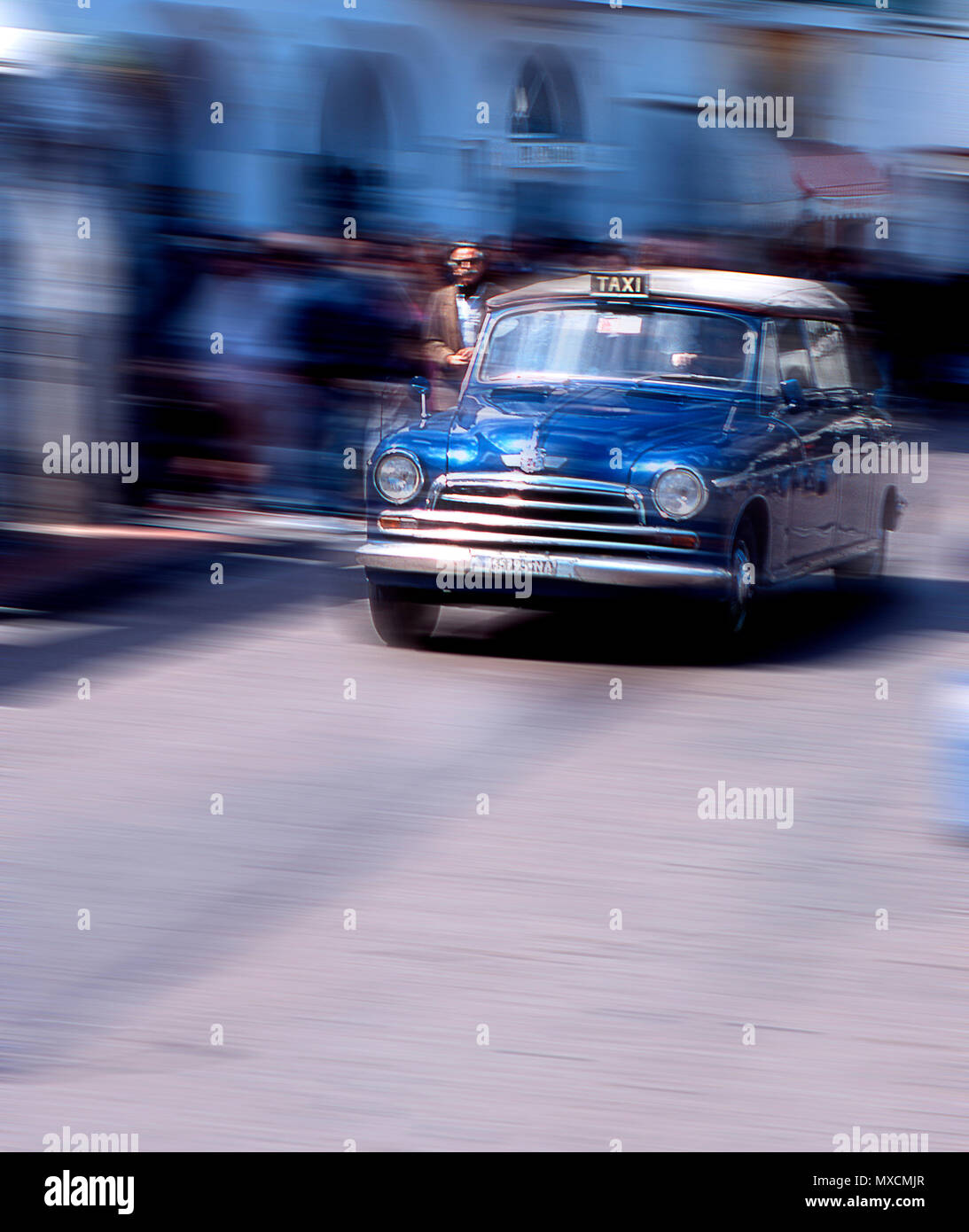 A conceptual image a vintage car and taxi travelling the climb from the ...