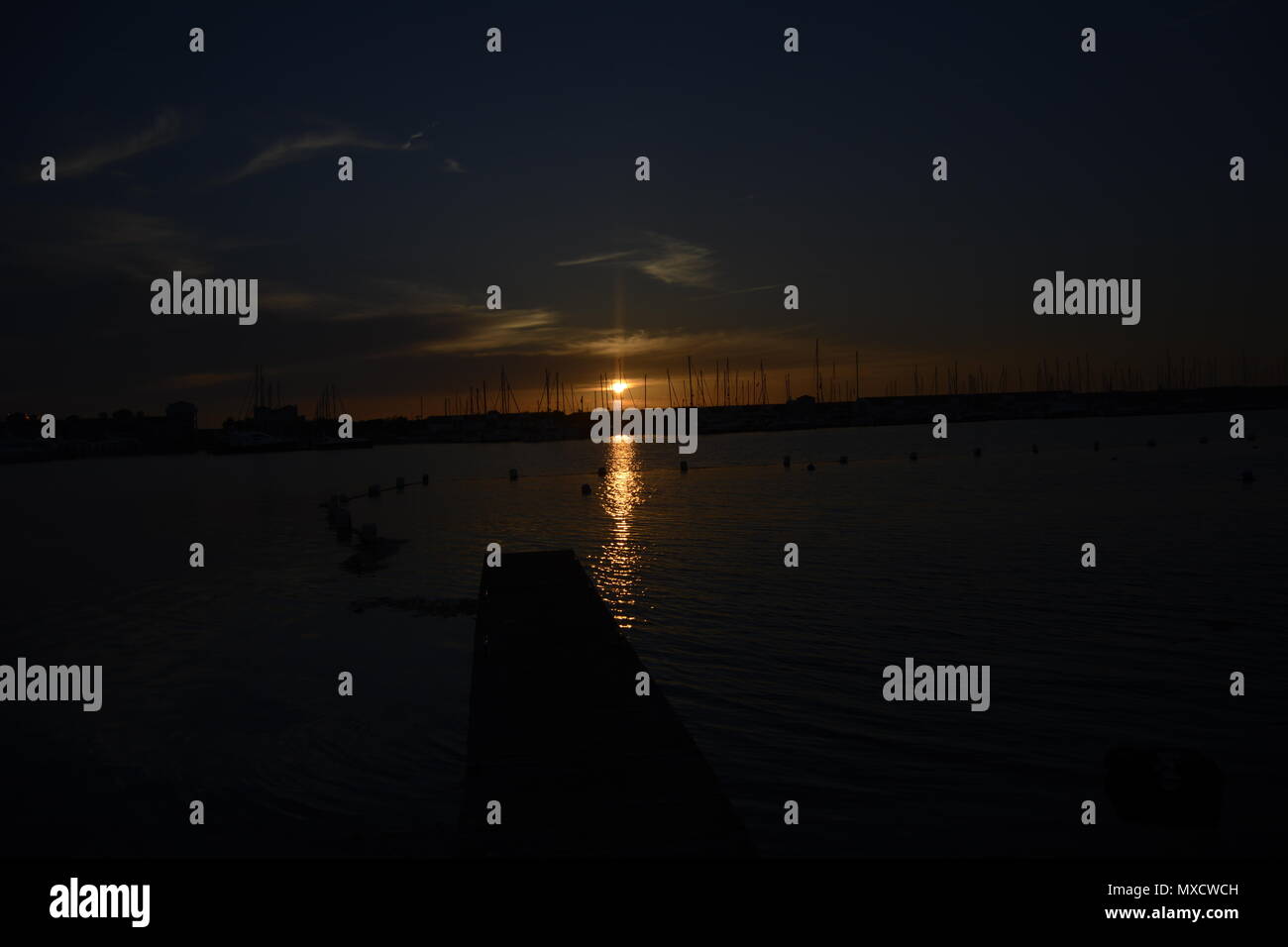 Sunset with jetty Stock Photo - Alamy
