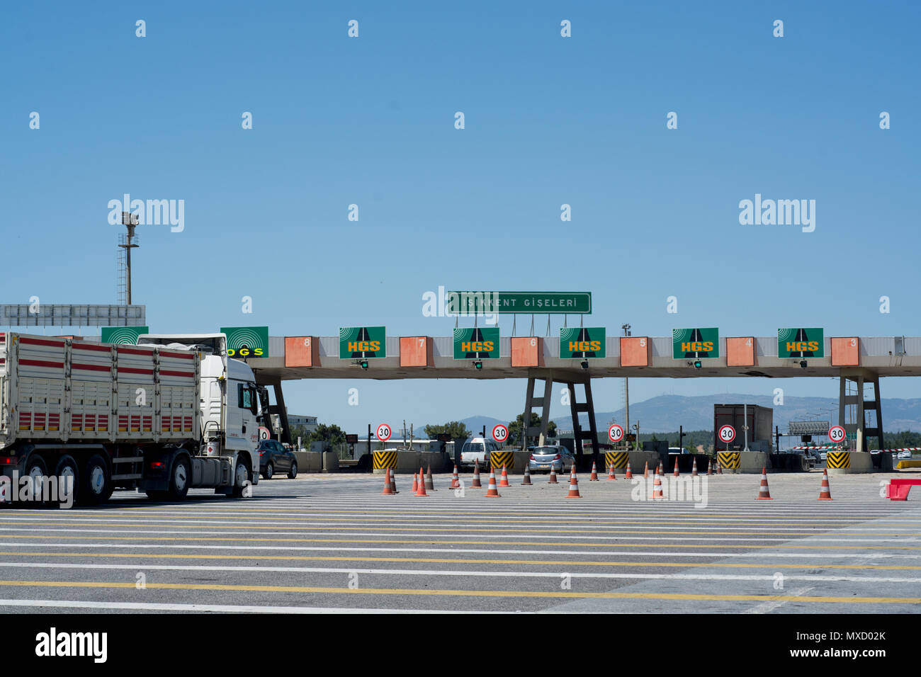 Cars passing through the toll gate Stock Photo - Alamy