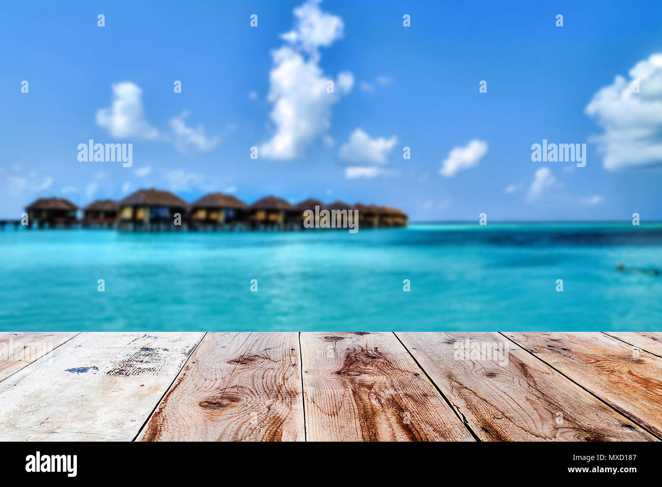 wooden front with maldives blurred background, wooden bungalows and one ...