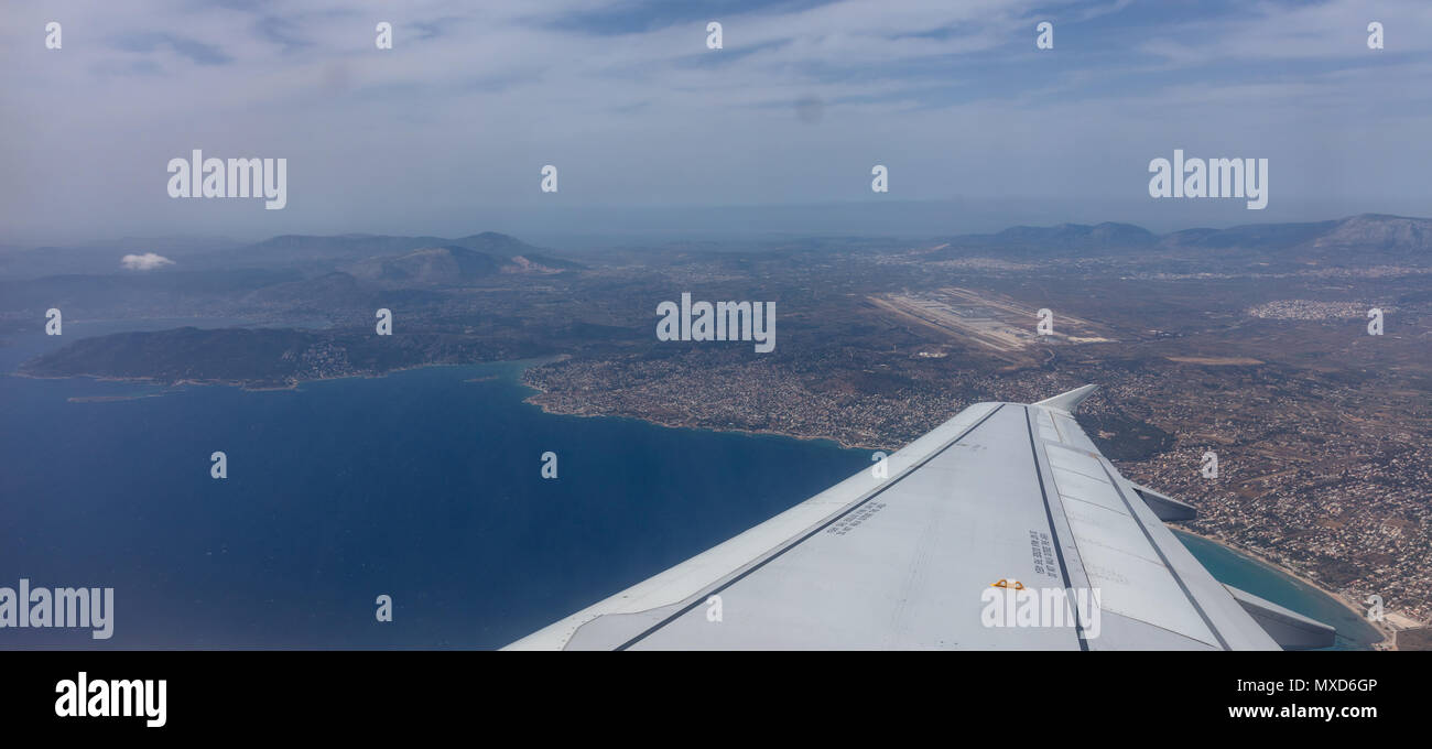 Plane approaching Athens, Greece airport. View out of airplane window ...