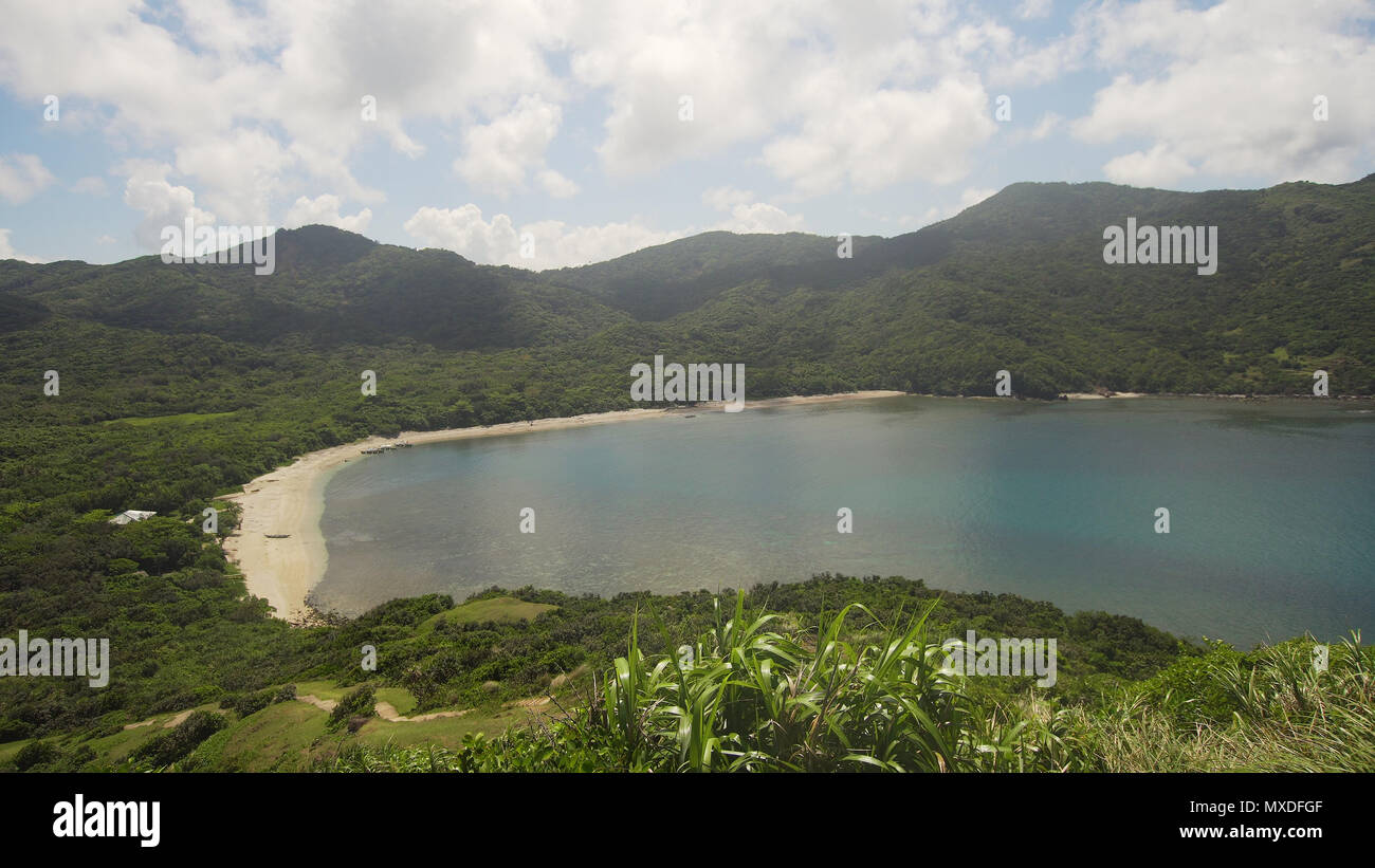Coast of a tropical island Palau with mountains covered with rainforest ...