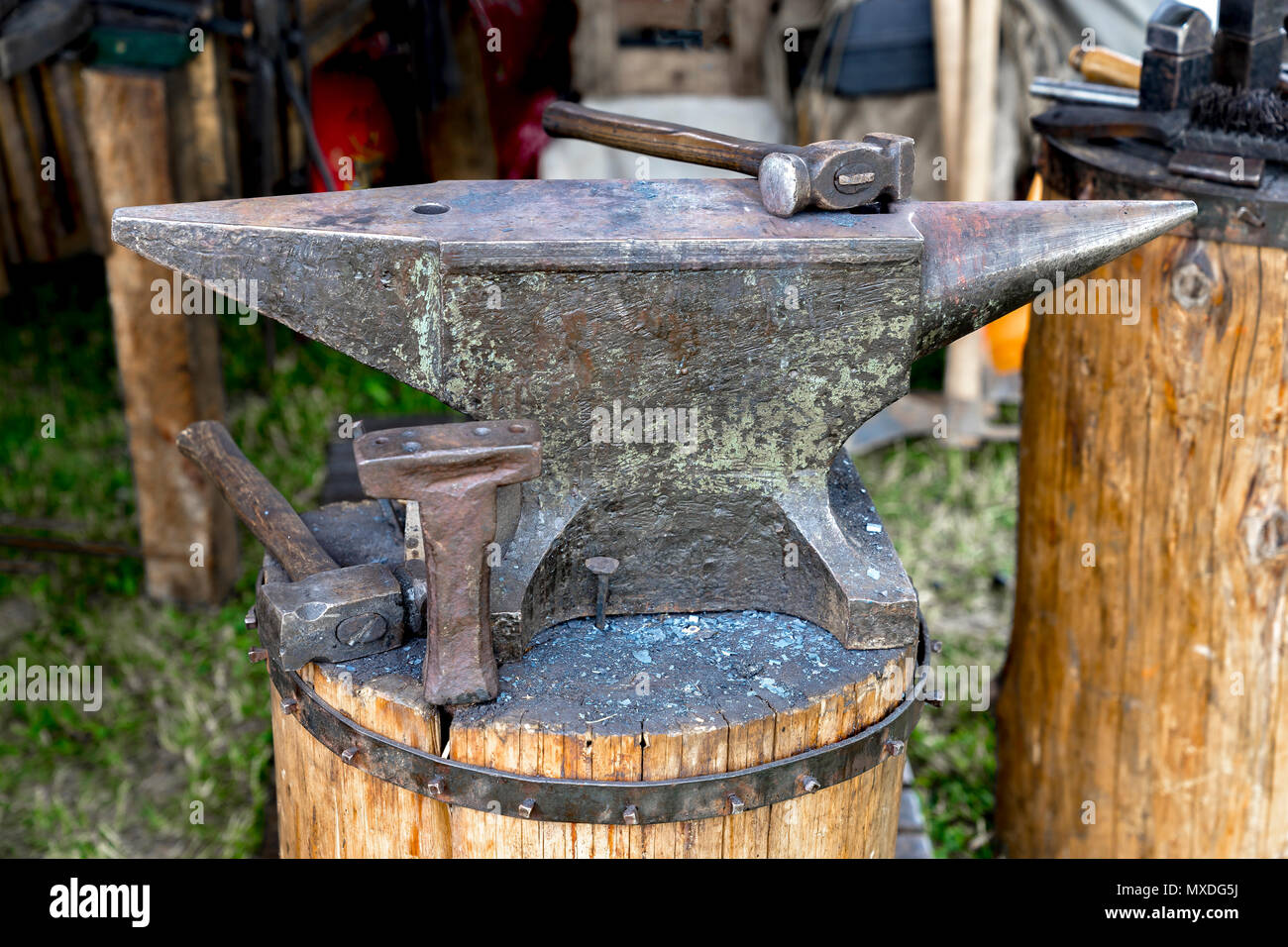 Anvil with two forging hammers in an outdoor forge Stock Photo - Alamy